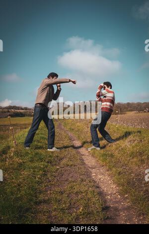 Two men training boxing fight in studio Stock Photo - Alamy