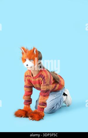 Quadrobics. Girl wearing fox mask, gloves and tail on grey background ...
