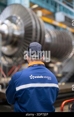 An Arabelle Solutions' employee work on a steam turbine rotor for ...