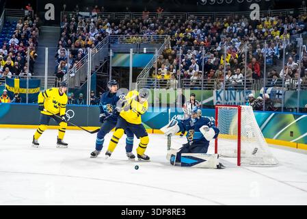 Finland goalkeeper Juuse Saros (74) blocks a shot by Slovakia's Matus ...