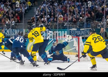 Finland goalkeeper Juuse Saros (74) blocks a shot by Slovakia's Matus ...