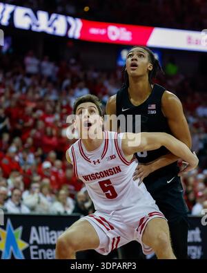 Michigan State forward Jordan Scott, left, pulls down a rebound against ...