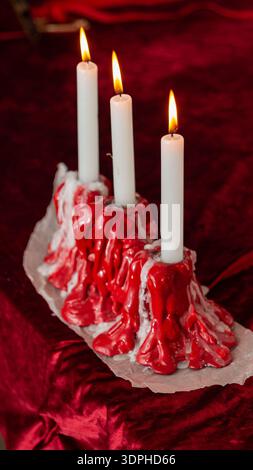 Close-up of melted red wax texture on a light background. Abstract ...