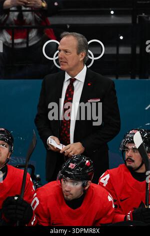 Canada head coach Jon Cooper talks with his players after their win ...