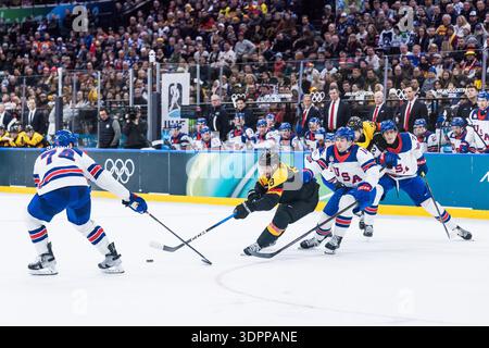 United States' Jaccob Slavin (74), Canada's Macklin Celebrini (17) and ...