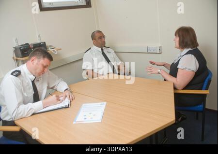 Police officers interviewing a suspect - played by a model Stock Photo ...