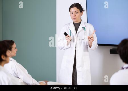 Young Asian female doctor presenting cosmetic product during virtual ...