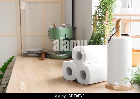Rolls of paper towels with plant on table in kitchen Stock Photo - Alamy