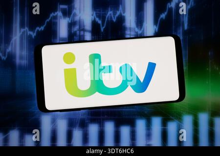 In this photo illustration, the logo of British media company ITV plc ...