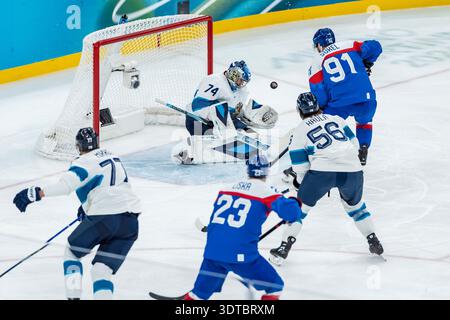 Finland goalkeeper Juuse Saros (74) blocks a shot by Slovakia's Matus ...