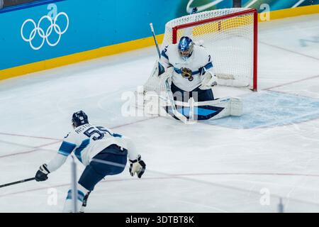 Finland goalkeeper Juuse Saros (74) blocks a shot by Slovakia's Matus ...