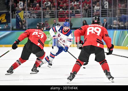 MILAN, ITALY - FEBRUARY 22: Drew Doughty of Canada L), Mitch Marner of ...