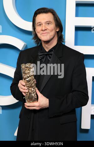 Jim Carrey poses with the Honorary Cesar Award during the 51st Cesar ...