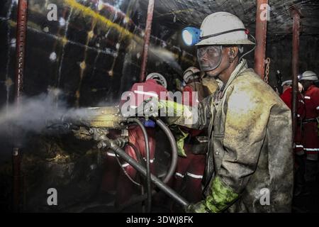 Underground Platinum Chrome miners drilling blast holes Stock Photo - Alamy