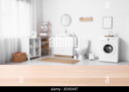 Empty wooden table in restroom, closeup Stock Photo - Alamy