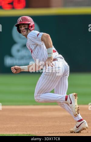 February 28, 2026: Razorback catcher Ryder Helfrick (27) looks to put a ...