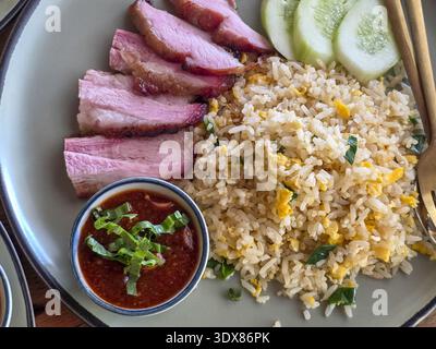 Delicious Thai fried rice featuring shrimp and squid, garnished with ...