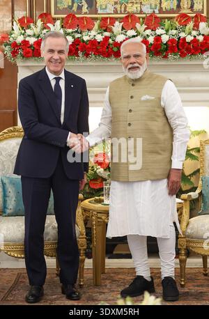 Prime Minister Mark Carney, left, pauses as B.C. Premier David Eby ...