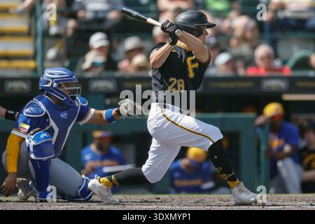 Pittsburgh Pirates' Jake Mangum scores on a double hit by Jared Triolo ...