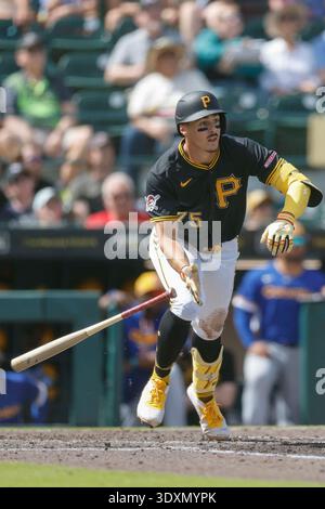 Pittsburgh Pirates' Jake Mangum scores on a double hit by Jared Triolo ...