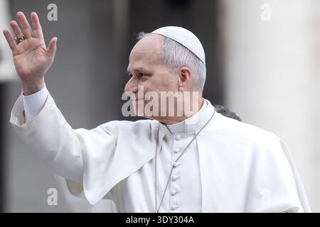 Pope Leo XIV waves as he arrives for his weekly general audience in St ...