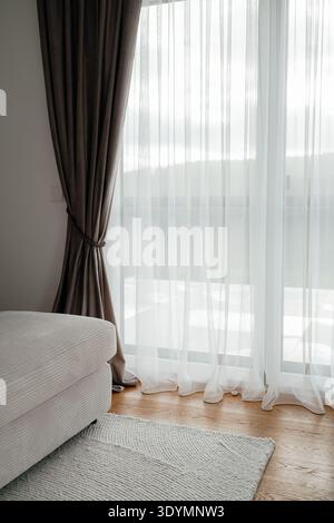 Interior of light living room with soft couch, armchair and coffee ...