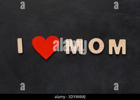 MOM word with heart symbol in black crayon texture style. Hand-drawn ...