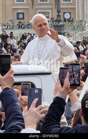 Pope Leo XIV waves during the Angelus noon prayer from the window of ...