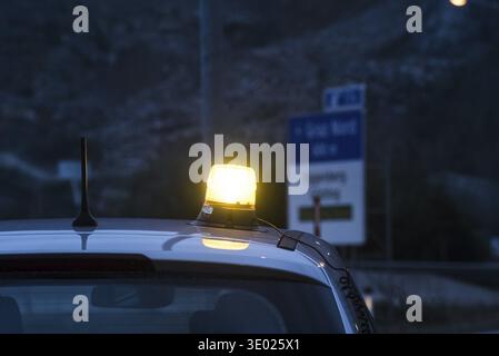 orange flashing light for a car, warning signal in road traffic orange ...