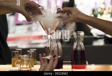 drinking a cold drink or beverage with smoke from cooling down drinking ...