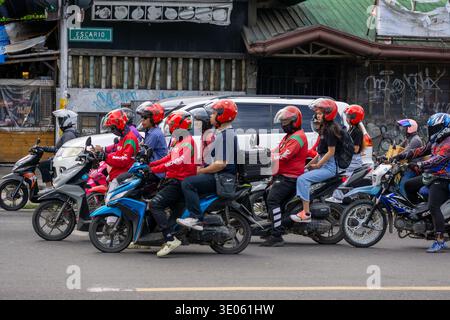 Motorcycle taxi riders wait to transport passengers in Bunia, Congo ...