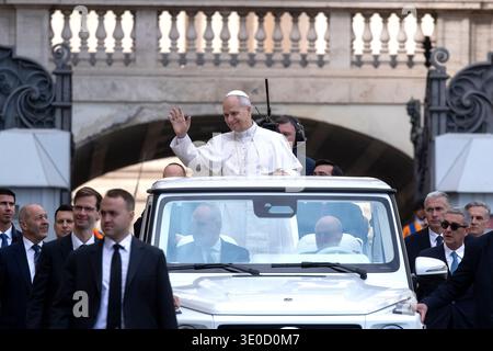Pope Leo XIV waves as he arrives for his weekly general audience in St ...