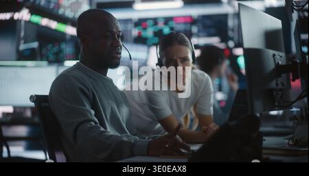 Traders analyze stock market trends with charts and graphs during ...