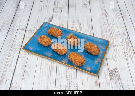 Stew croquettes, with chunks of meat and ham clearly visible in the ...