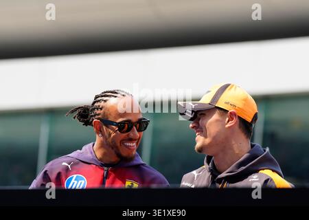 Lewis Hamilton of Great Britain and Scuderia Ferrari is on the podium ...