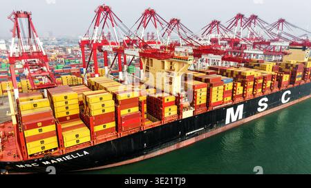 QINGDAO, CHINA - MARCH 18, 2026 - A cargo ship loaded with foreign ...