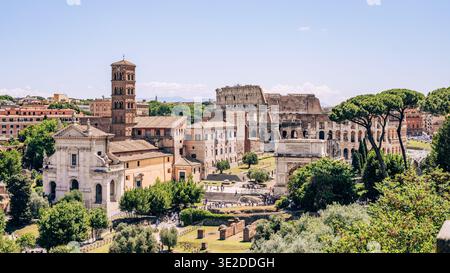 People walk past the ancient Colosseum as they take part in the Pride ...