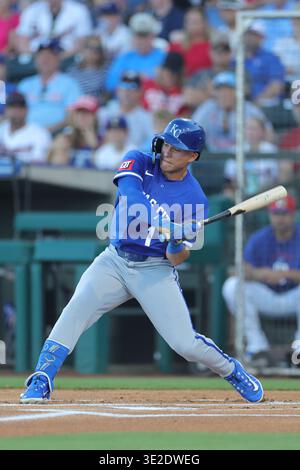 Kansas City Royals' Isaac Collins, left, rounds second base during the ...