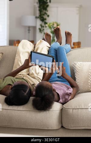Mother holding child, pointing together, enjoying the scenic view and ...