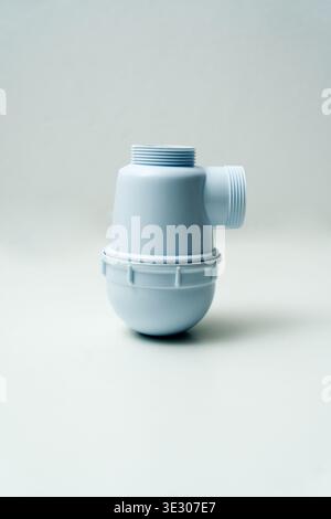 White Plastic Pipe Connectors on Wooden Background Stock Photo - Alamy