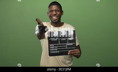 Happy man smiling broadly, extending his arm to take a selfie in a ...