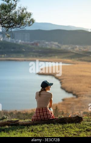 Solo woman enjoying a vacation in paris, wearing a red beret ...