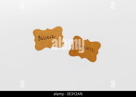Cards in hand on brown background Stock Photo - Alamy