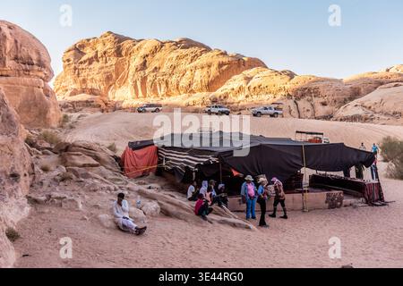 WADI RUM, JORDAN - JULY 13, 2022: Two bedouin men smoking a hookah ...