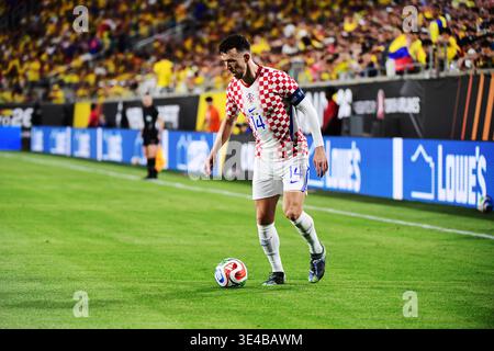 Croatia forward Ivan Perisic (14) heads the ball as he is defended by ...