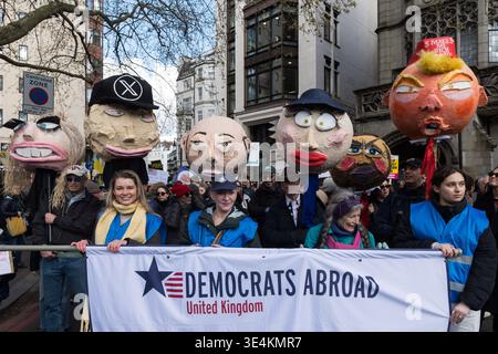 A papier-mache depicting President Donald Trump holding money while ...