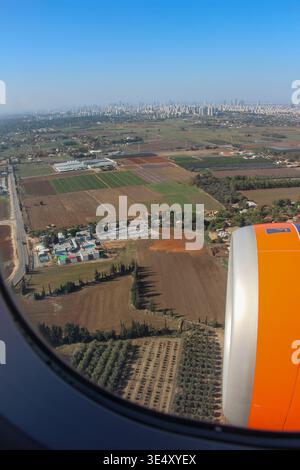View from airplane window featuring aircraft wing flying high above ...