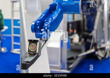 Close-up of an industrial robotic arm component with metal parts and ...