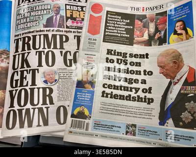 Britain's King Charles III and Queen Camilla react as they follow a ...