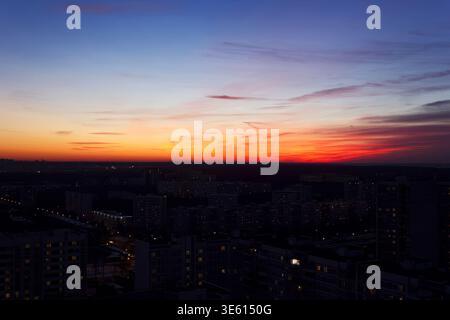 Sunset lights the sky over a Moscow district in Moscow, Russia, Monday ...